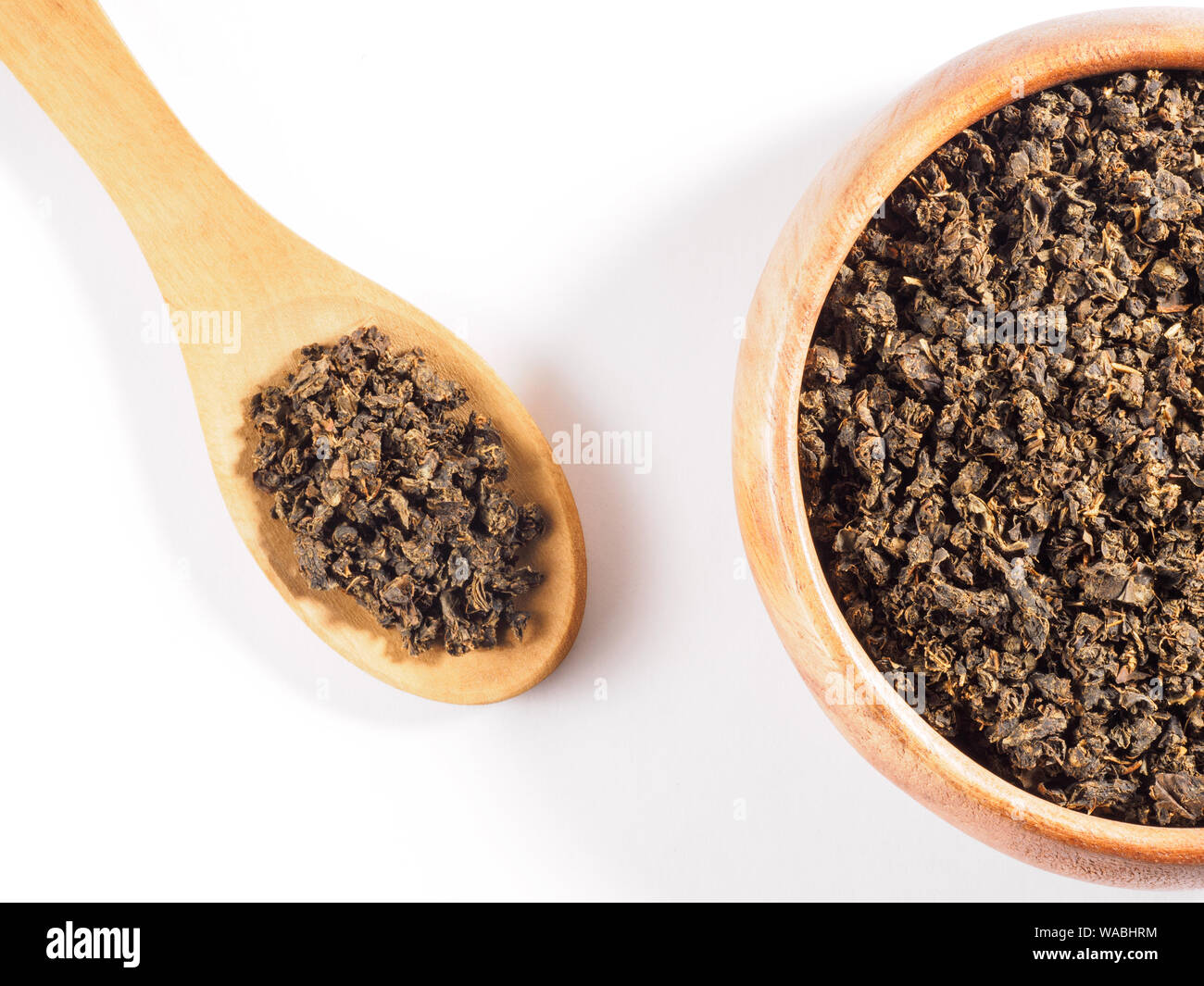 Fermented granular tea from Cherry (Cerasus) leaves in wooden cup with ...