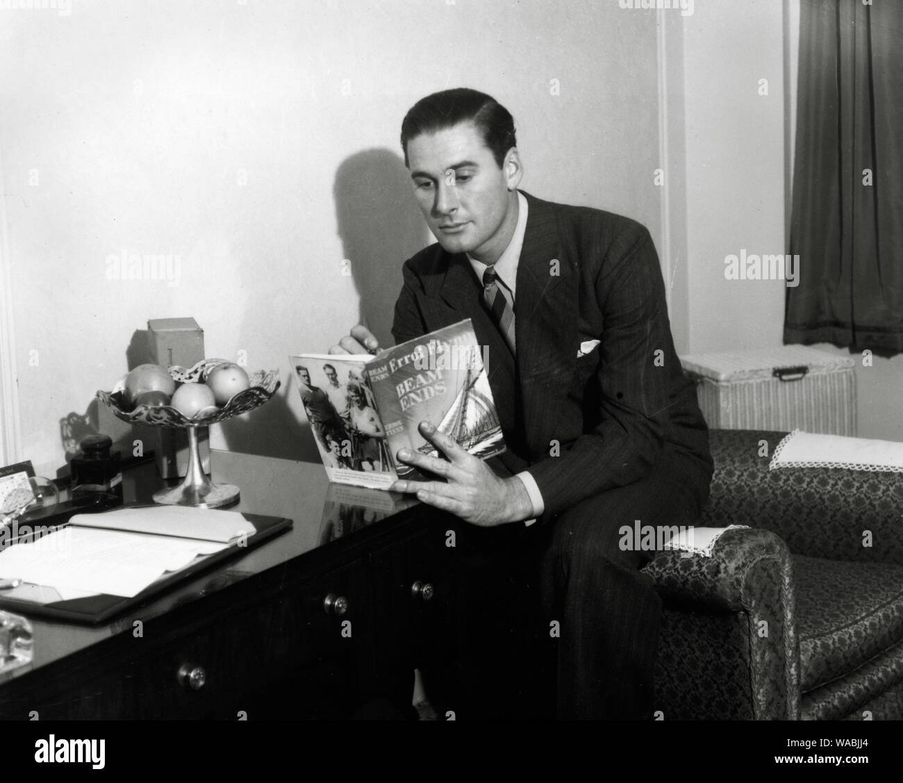 Errol Flynn reading his book, "Beam Ends" (circa 1937) File Reference ...