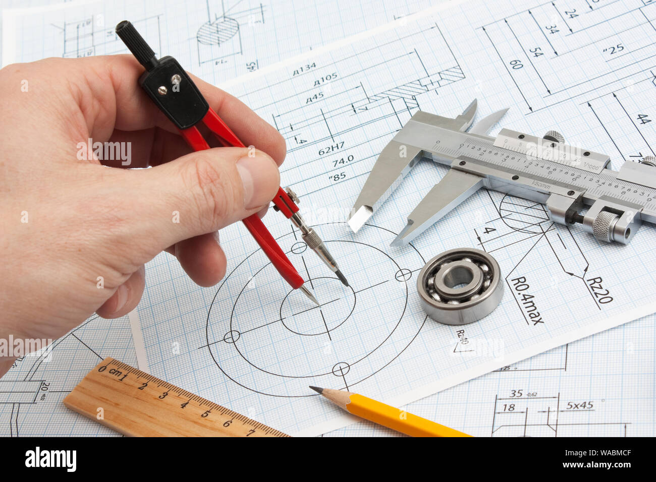 technical drawing and tools in hand Stock Photo - Alamy