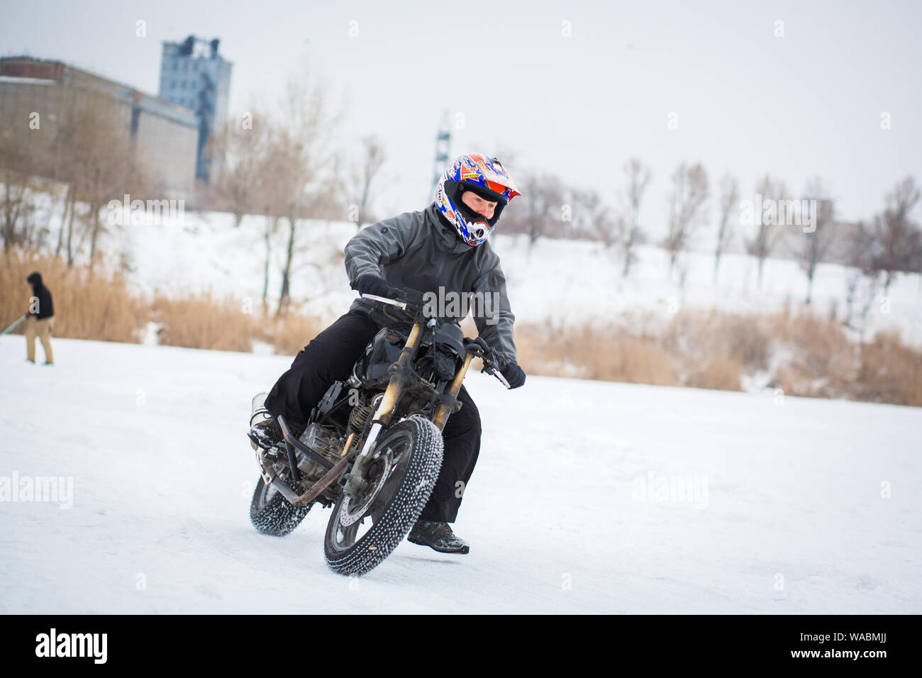 A guy rides a motorcycle on a frozen lake Stock Photo - Alamy