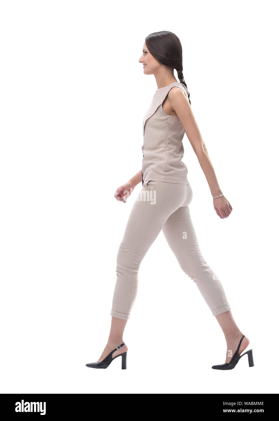 side view. confident young woman stepping forward Stock Photo - Alamy