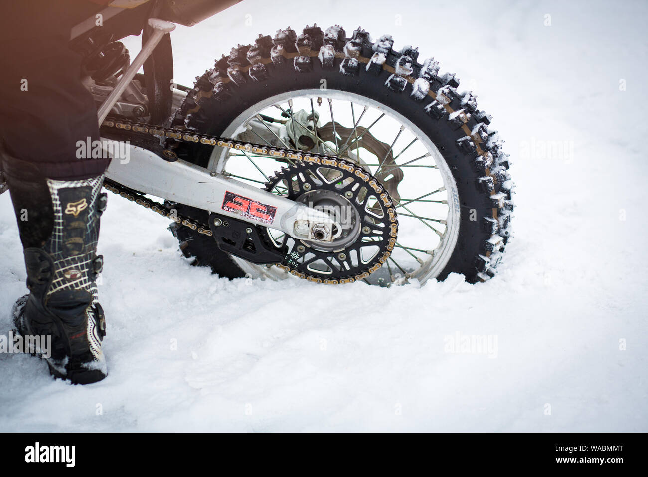 A guy rides a motorcycle on a frozen lake Stock Photo - Alamy