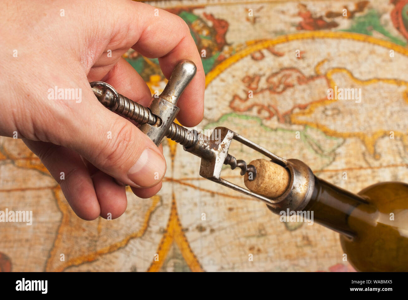 pulling corkscrew cork from the bottle Stock Photo - Alamy