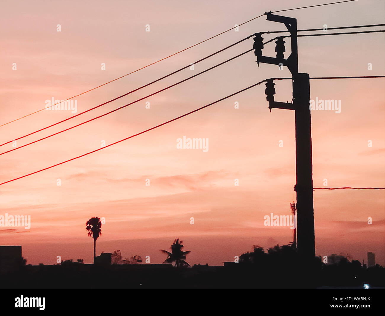 The electric pole and electric transformer at sunset orange sky Stock ...