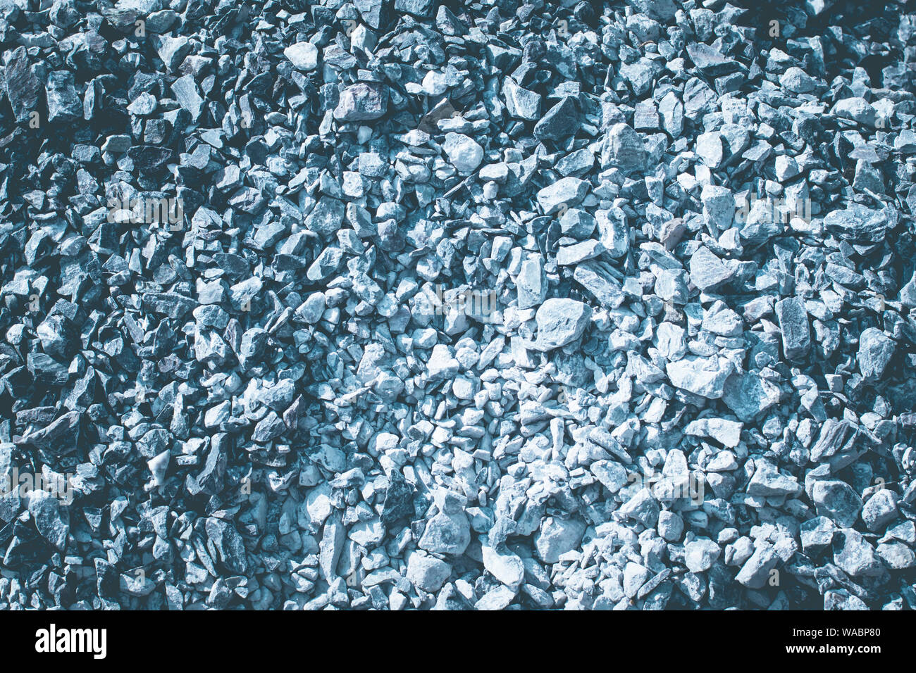 small basalt stones stack background Stock Photo - Alamy