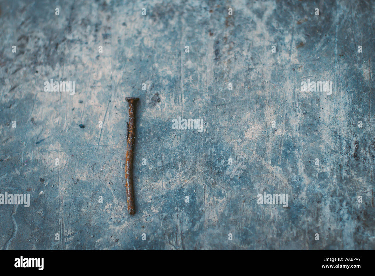 old rust nail on concrete background abstract construction business ...