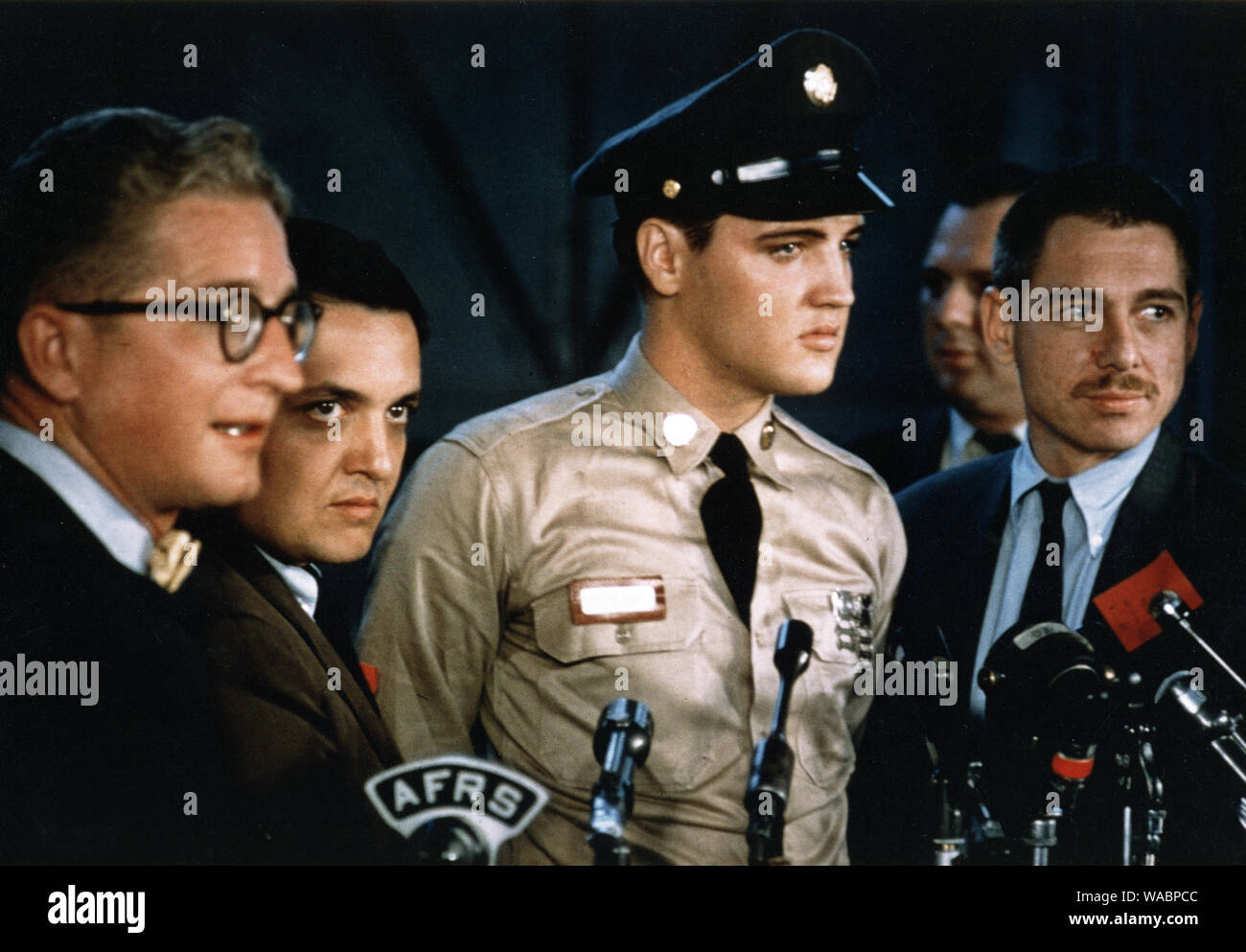 Elvis Presley at a press conference during his tour of duty in the U.S ...