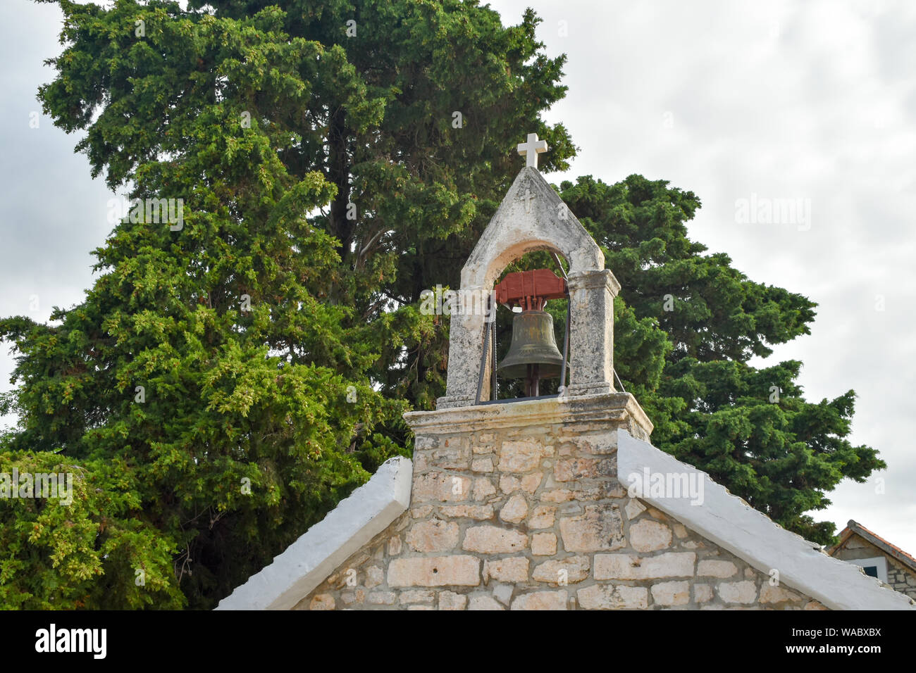 Bell tower of old stone church Stock Photo - Alamy