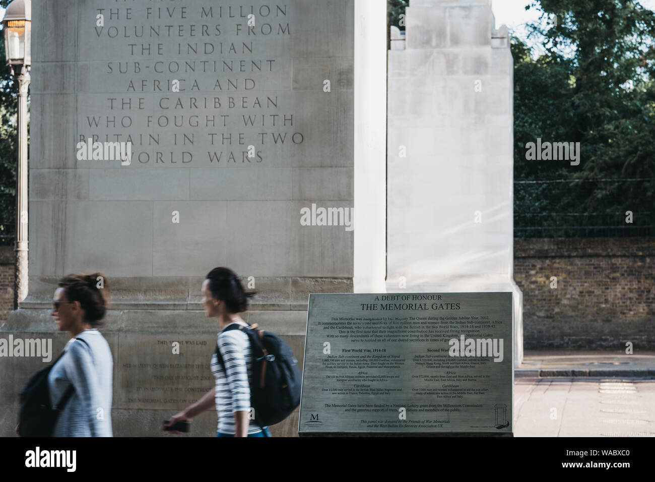 London, UK - July 15, 2019: People walking past The Memorial Gates ...