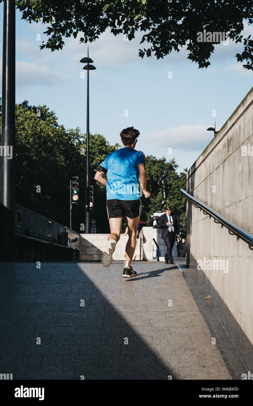 London, UK - July 15, 2019: Man running out of Hyde Park Corner Subway ...