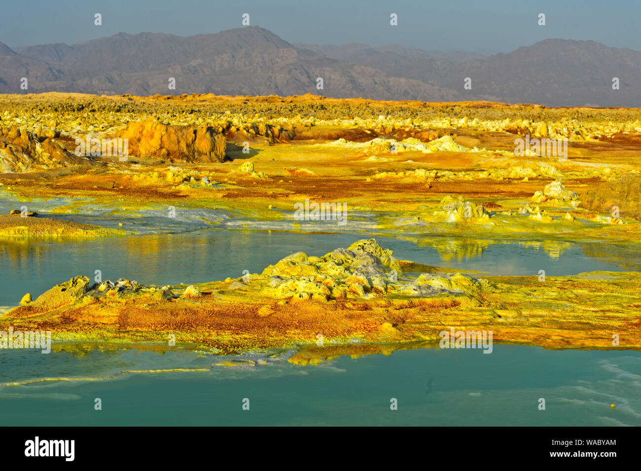 Sulphure rock formations in an acid brine pool, geothermal field of ...