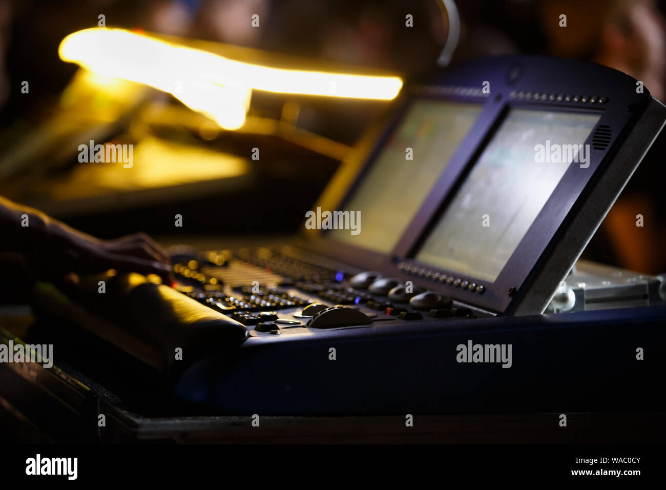 Stage lighting controller panel on rock concert in nightclub ...