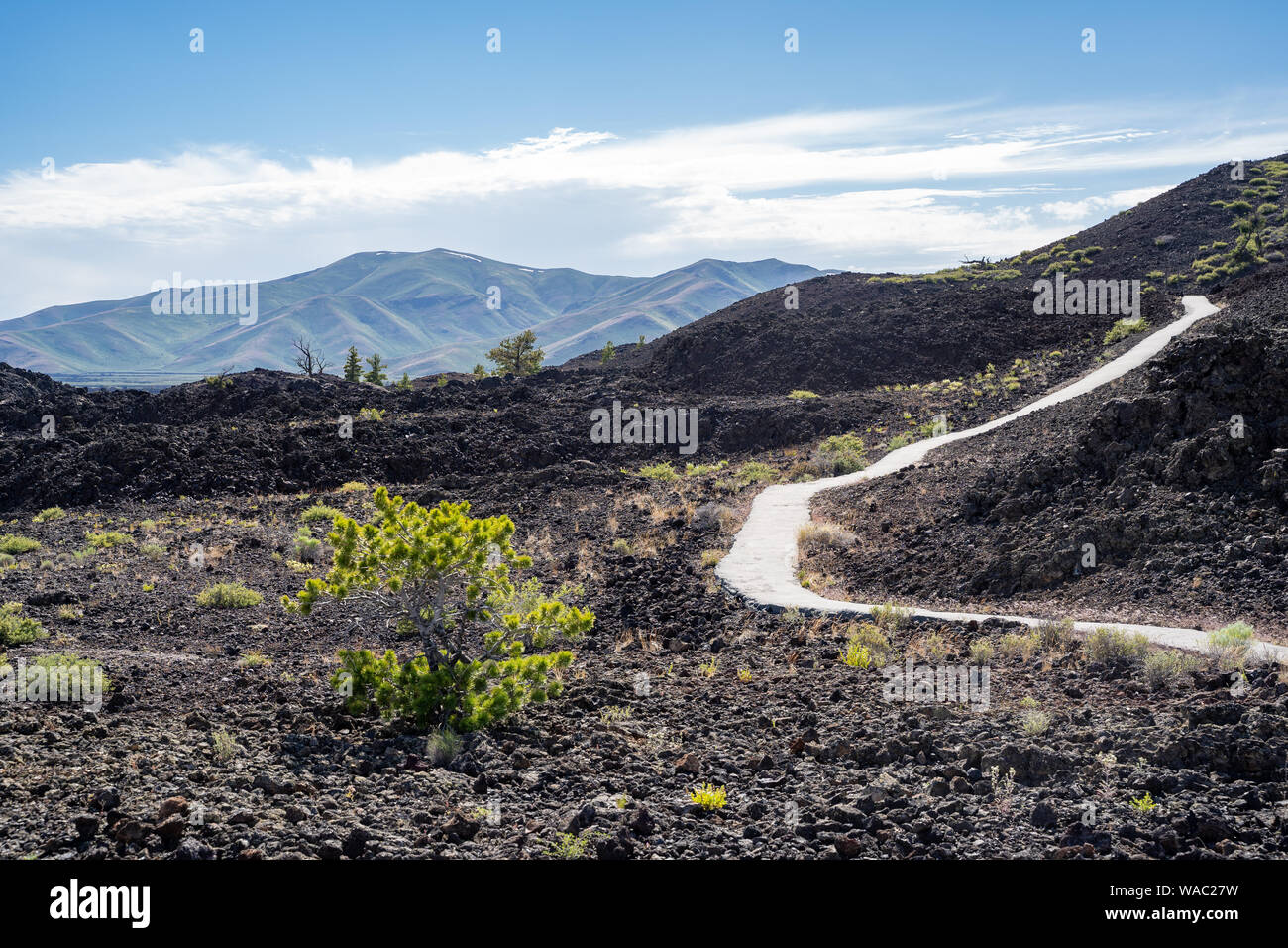 Spatter Cones trail, a paved walkway leading to a cinder cone wi in ...