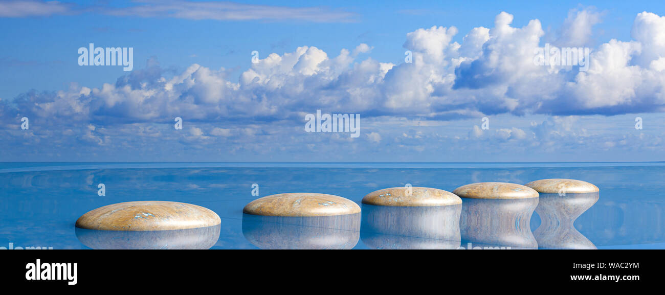 Zen stones row from large to small in water with blue sky and peaceful ...
