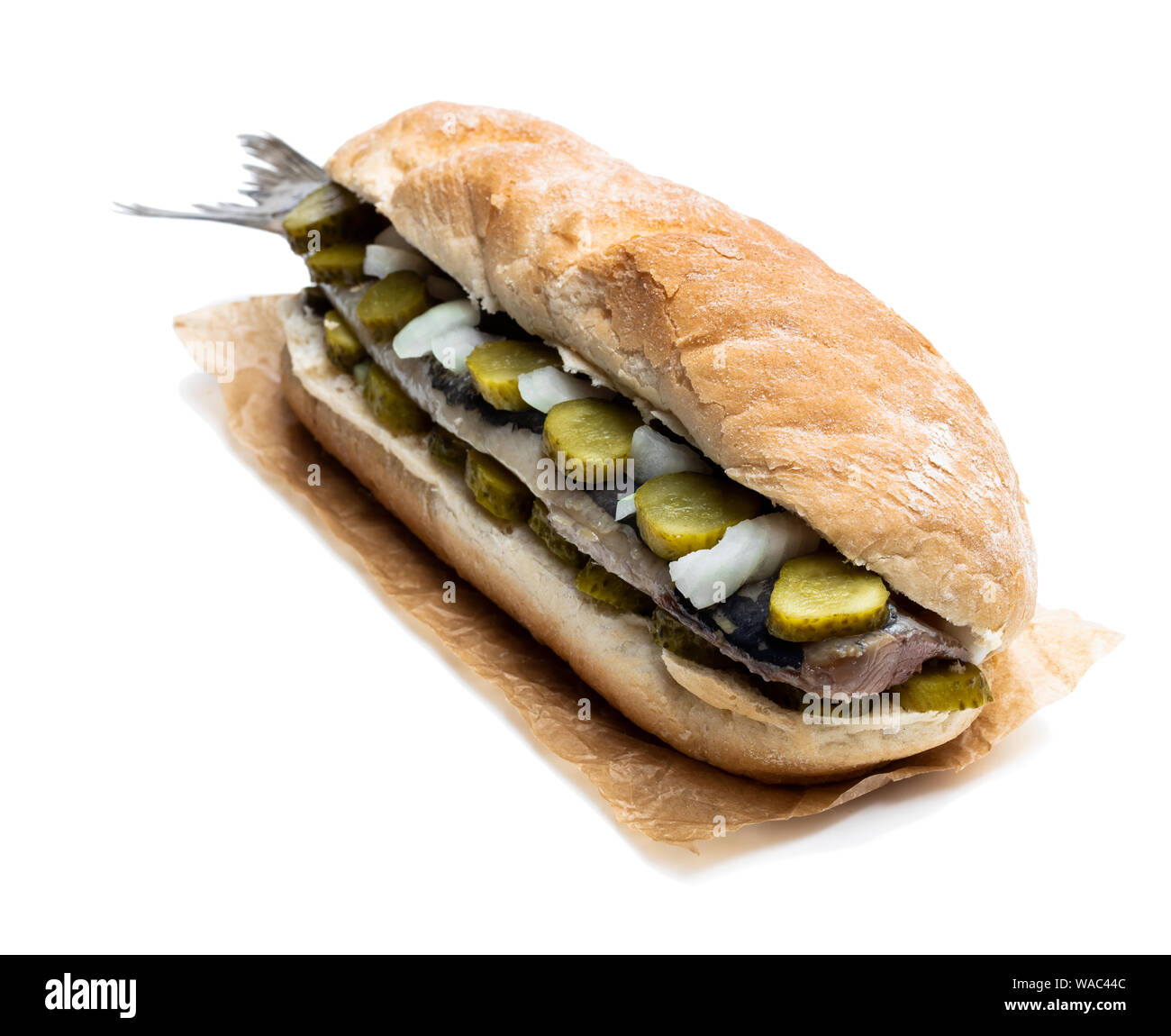 Traditional Dutch sandwich with herring and pickles isolated on white ...