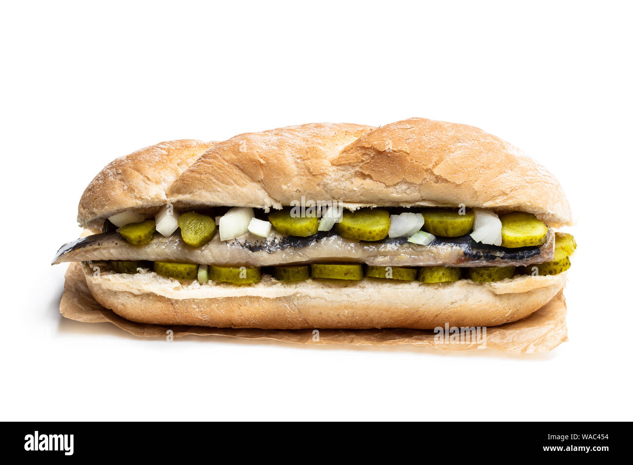 Traditional Dutch sandwich with herring and pickles isolated on white ...