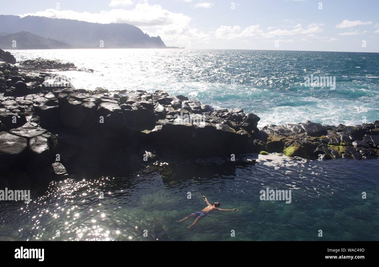 Soaking sun on beach hi-res stock photography and images - Alamy