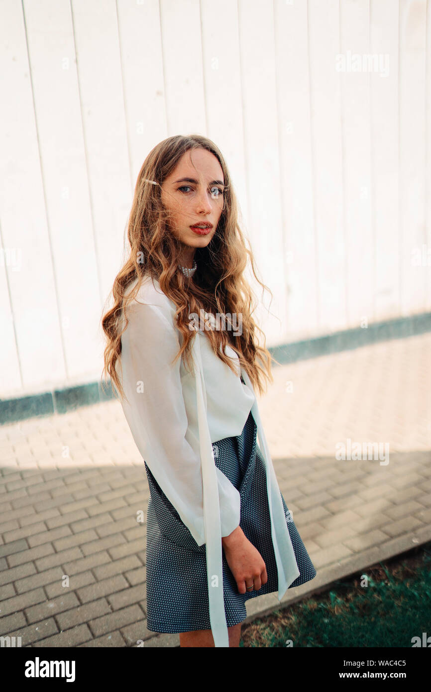 Portrait of a woman standing outside Stock Photo - Alamy
