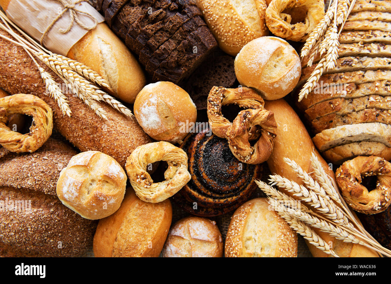 Assortment of baked bread as a food background Stock Photo - Alamy