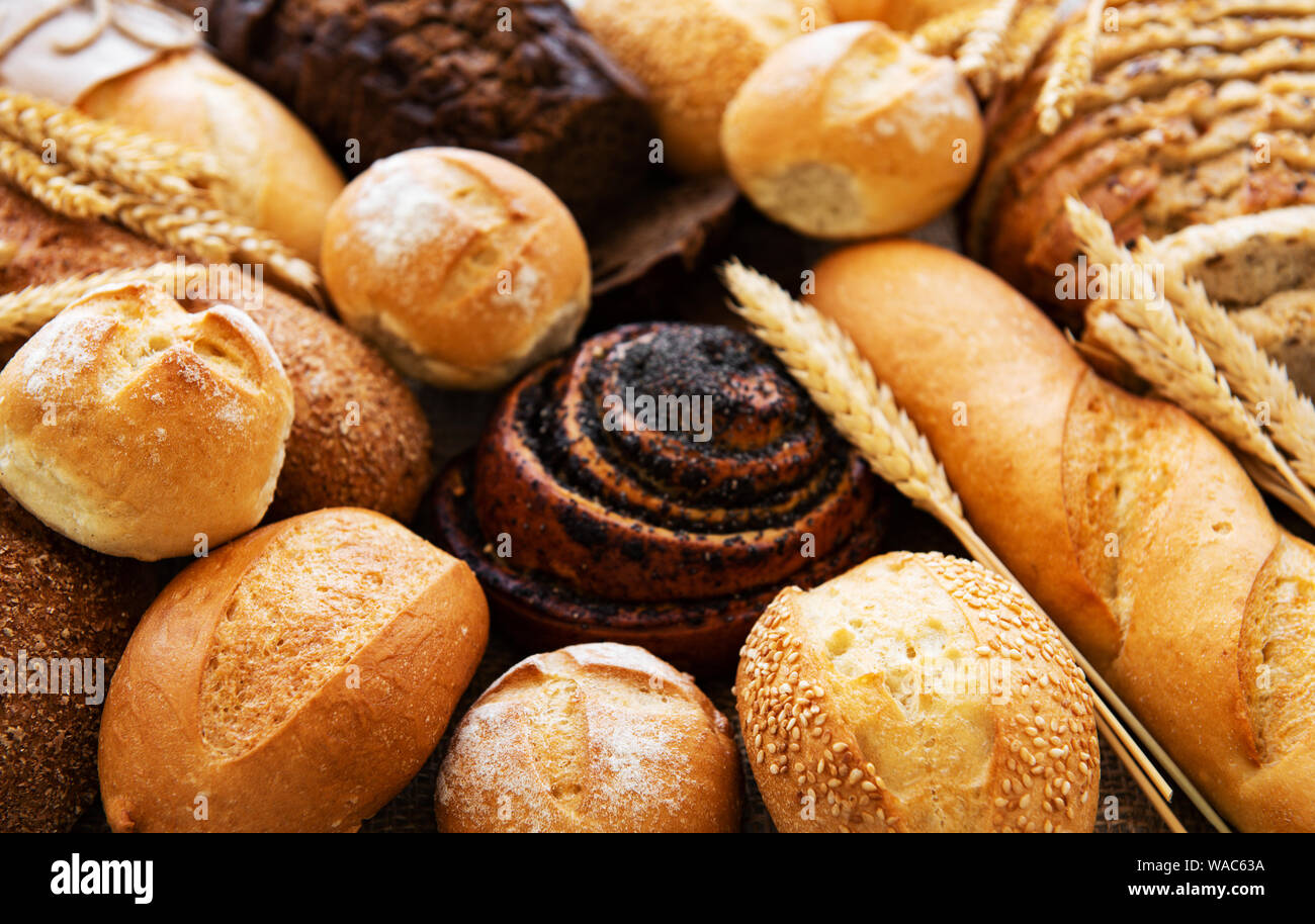 Assortment of baked bread as a food background Stock Photo - Alamy
