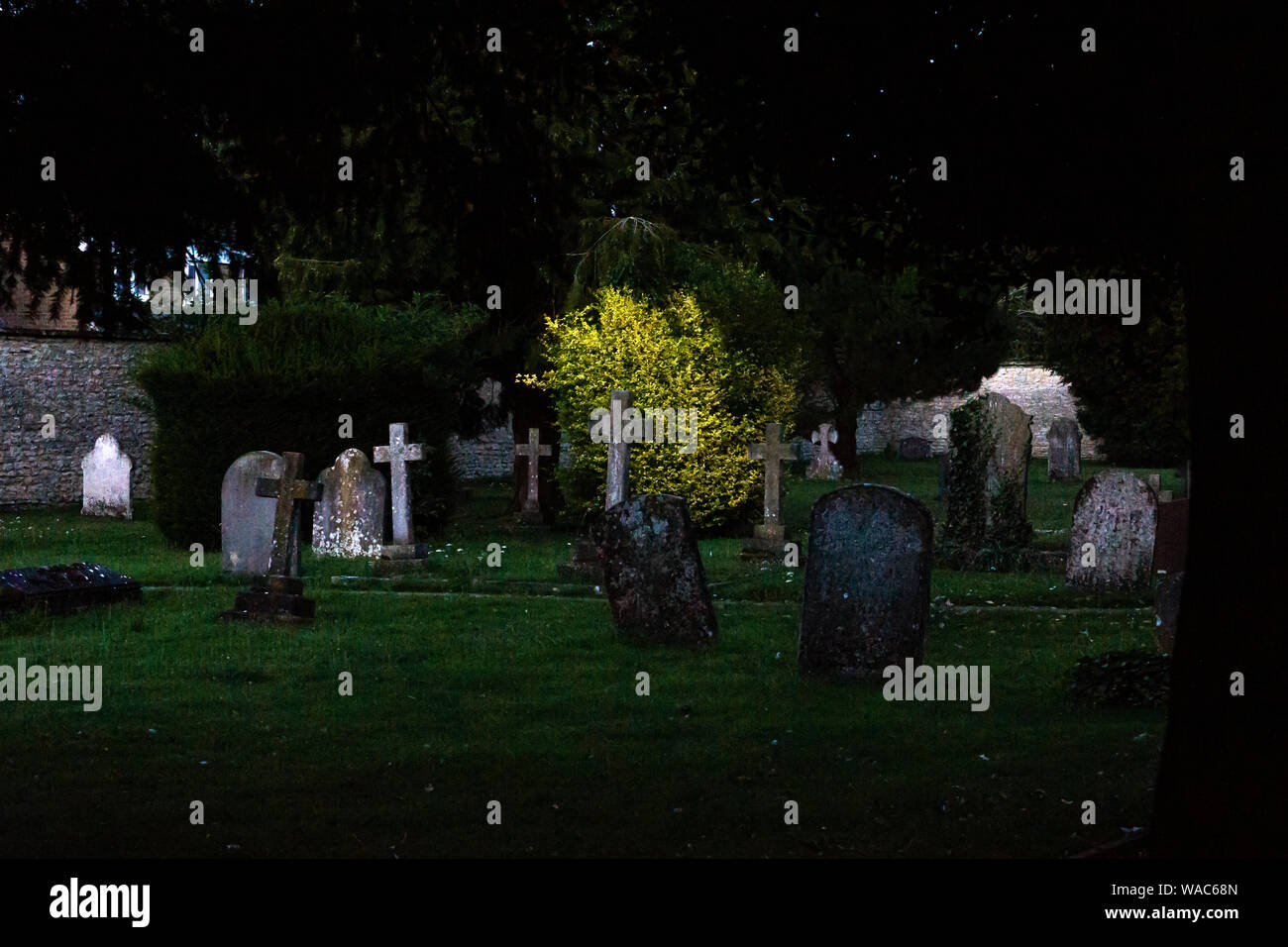Church graveyard at dusk Stock Photo - Alamy