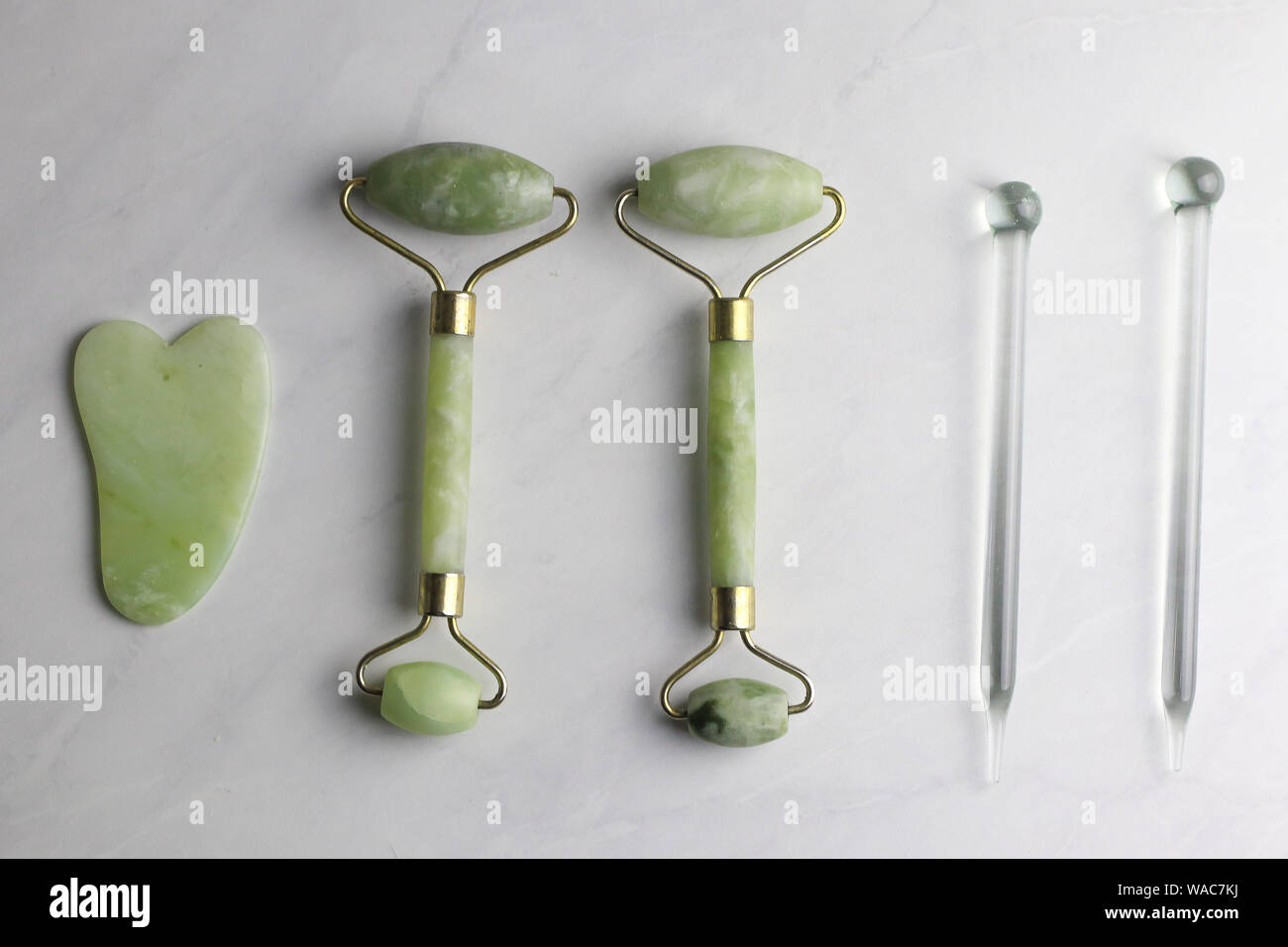 Facial and body stone massage instruments on light background Stock ...