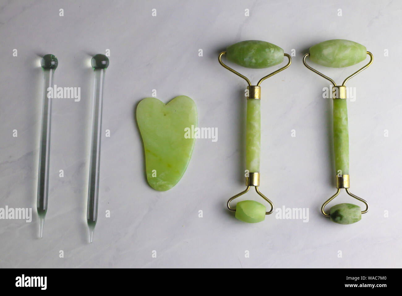 Facial and body stone massage instruments on light background Stock ...