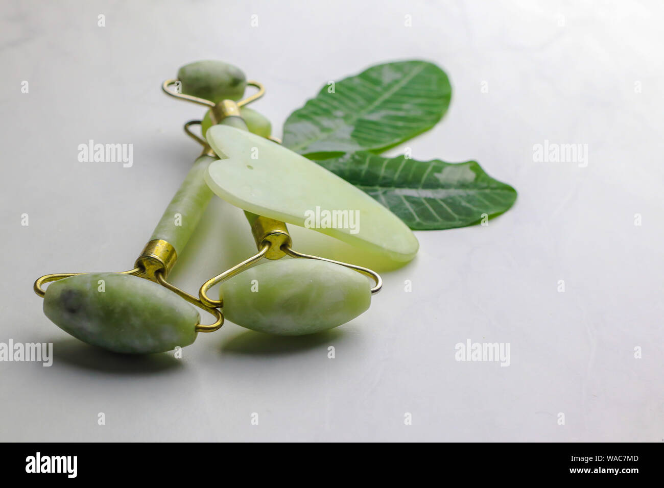 Facial and body stone massage instruments on light background Stock ...