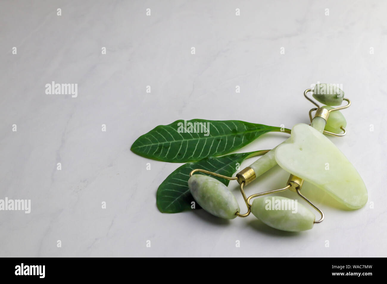 Facial and body stone massage instruments on light background Stock ...