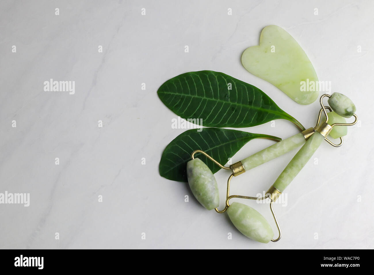 Facial and body stone massage instruments on light background Stock ...