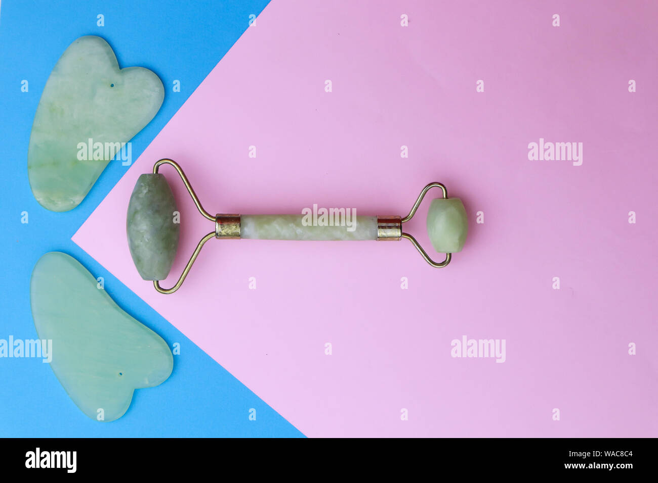 Facial and body stone massage instruments on color background Stock ...