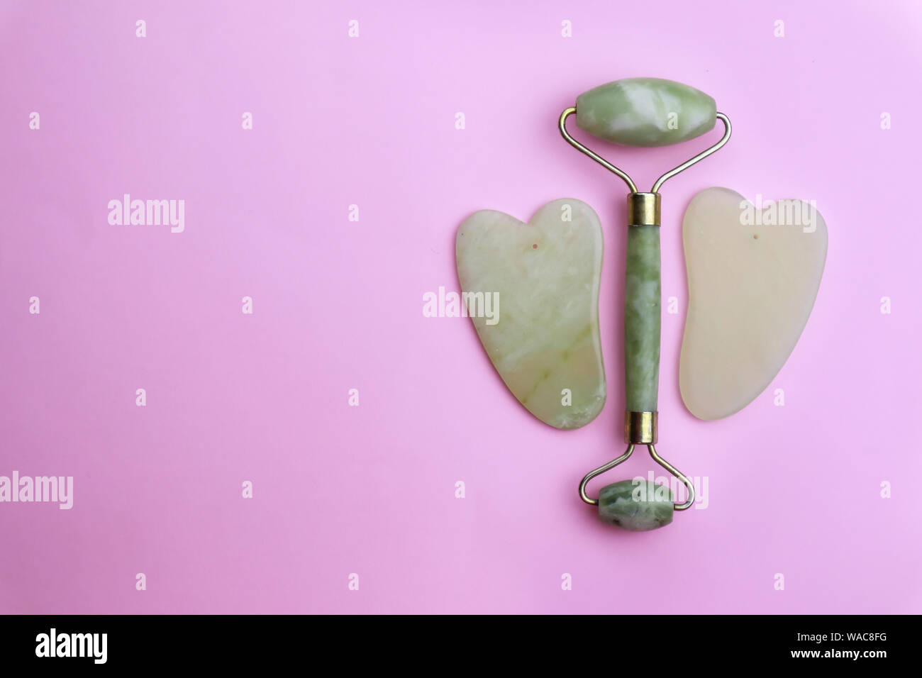 Facial and body stone massage instruments on color background Stock ...