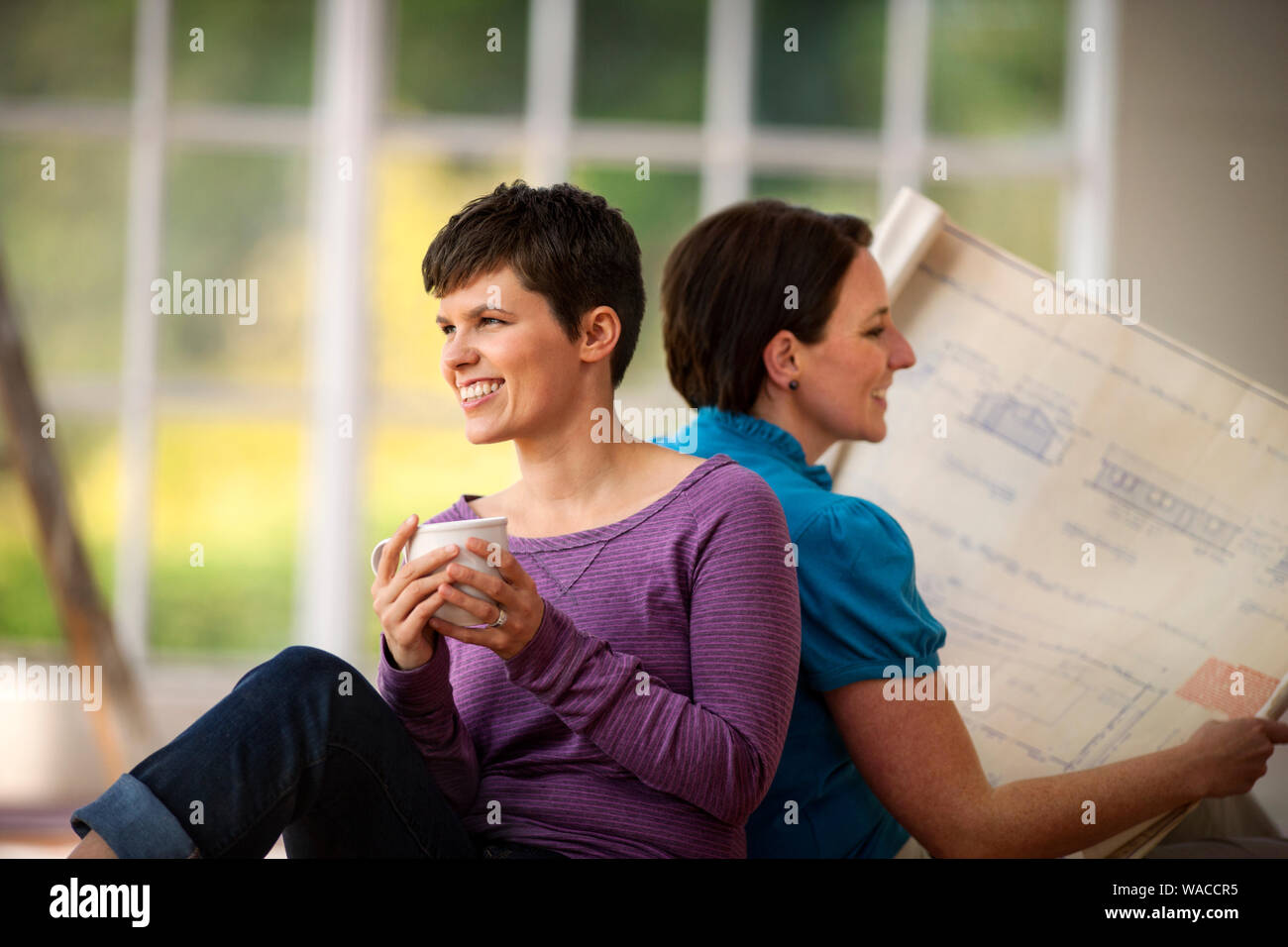 Mid adult couple bonding in their new home Stock Photo - Alamy