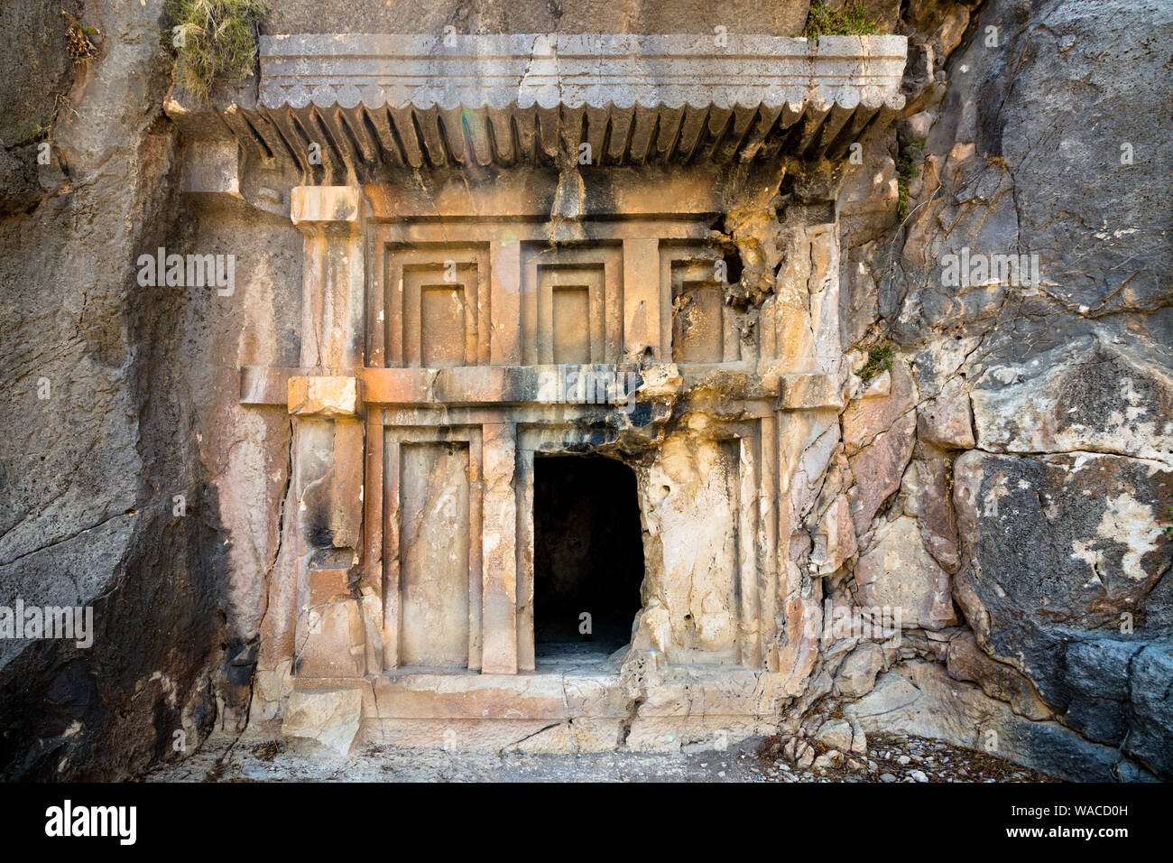 Entrance to the tomb of ancient civilization. Tombs are carved into the ...