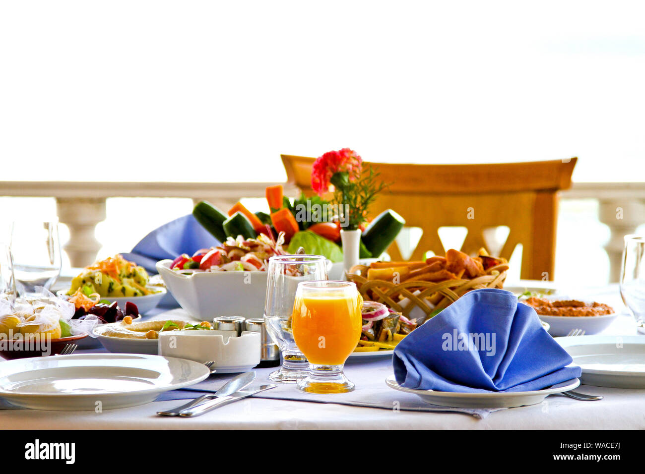 Elegant set up table with tasty food Stock Photo - Alamy