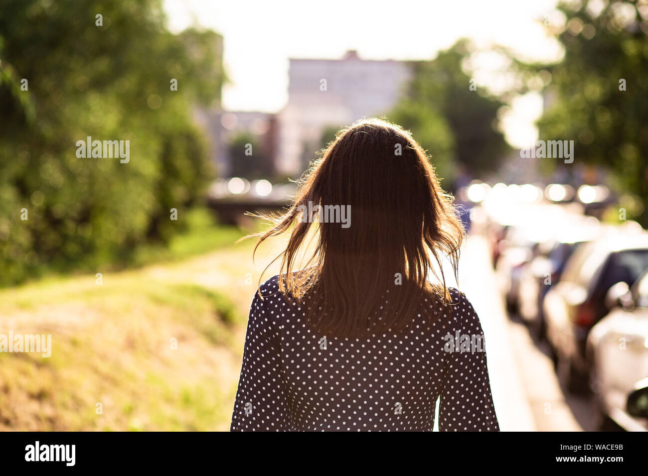 Woman back view walking street hi-res stock photography and images - Alamy