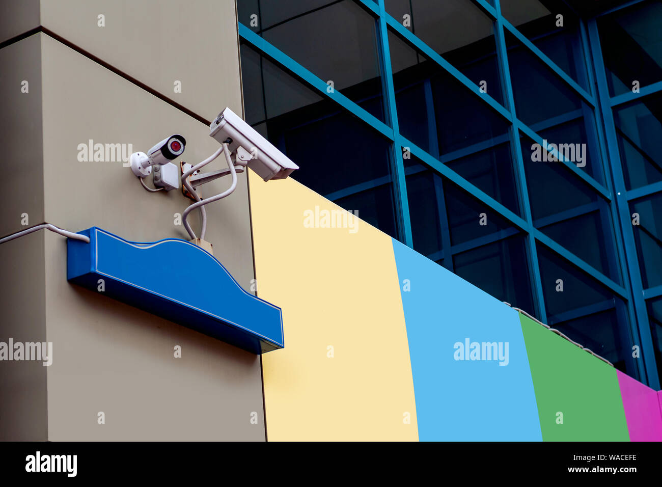 Surveillance camera on the corner of the house. Security and control ...