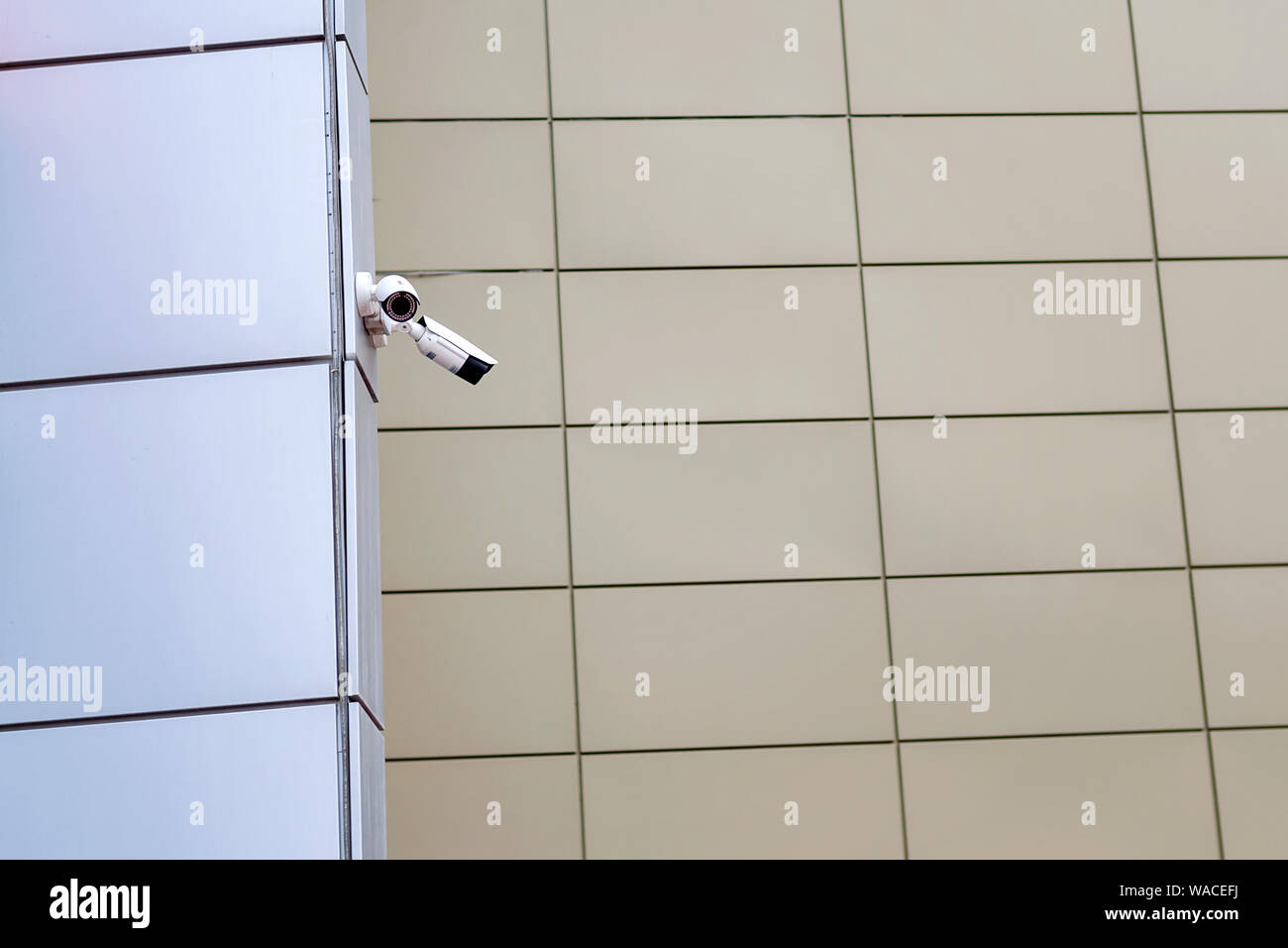 Surveillance camera on the corner of the house. Security and control ...