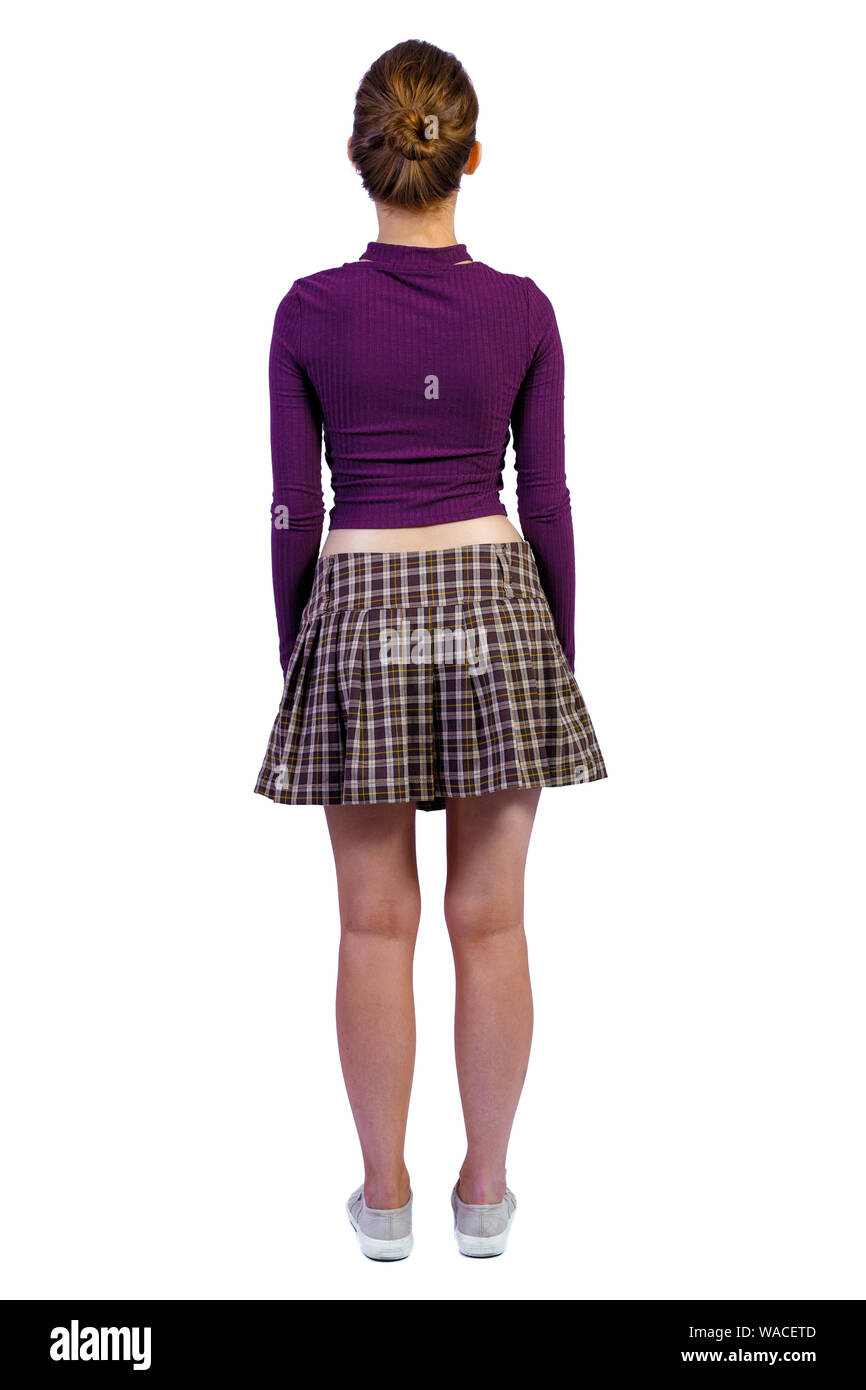 back view of standing young beautiful woman. girl watching. Rear view ...