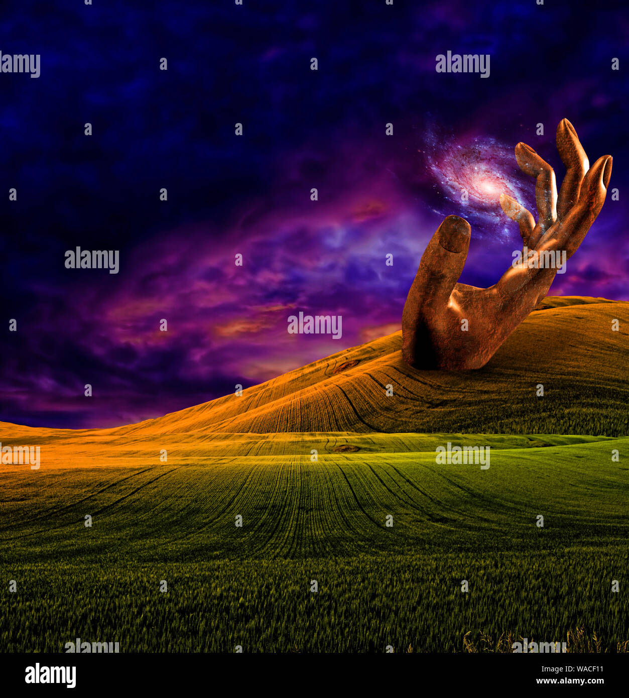 Hand holds galaxy in surreal scene Stock Photo - Alamy