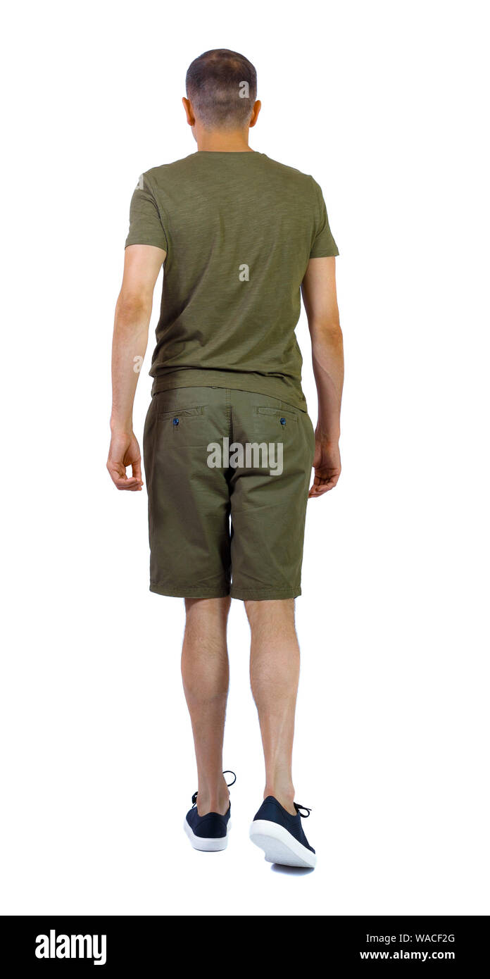 Back view of going handsome man in shorts. walking young guy . Rear ...