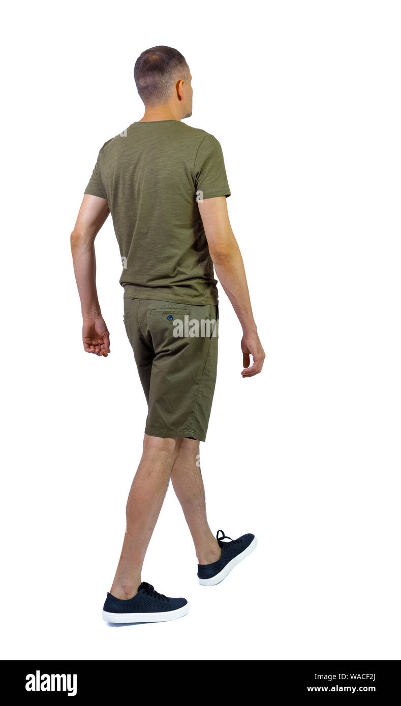 Back view of going handsome man in shorts. walking young guy . Rear ...