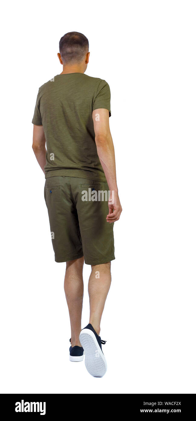 Back view of going handsome man in shorts. walking young guy . Rear ...