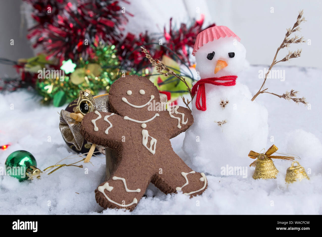 Gingerbread Man and Snowman in the Snow Stock Photo - Alamy