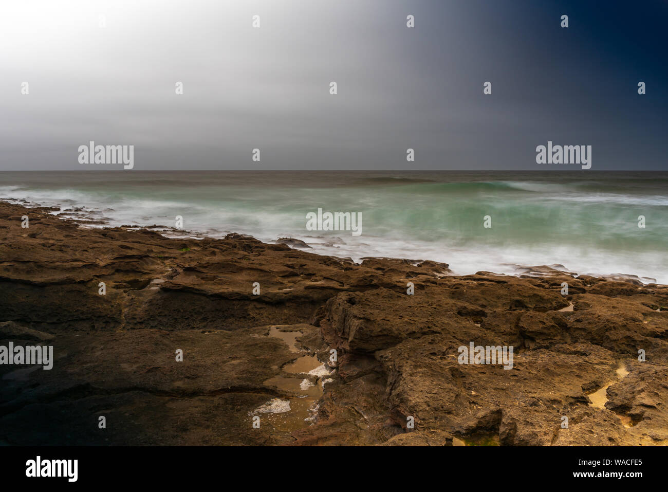 Ocean waves breaking in a beach Stock Photo - Alamy
