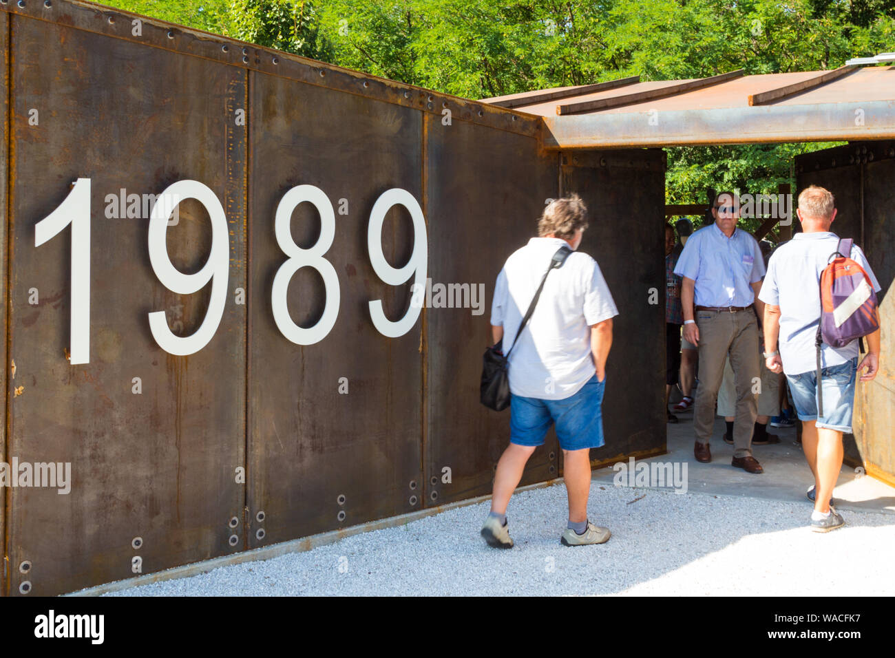 People watching the memorial statue of the 1989 Breakthrough at the Pan ...