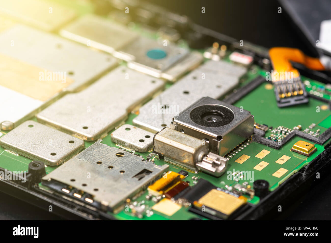 Repairing a broken smartphone, open and disassembled closeup macro ...