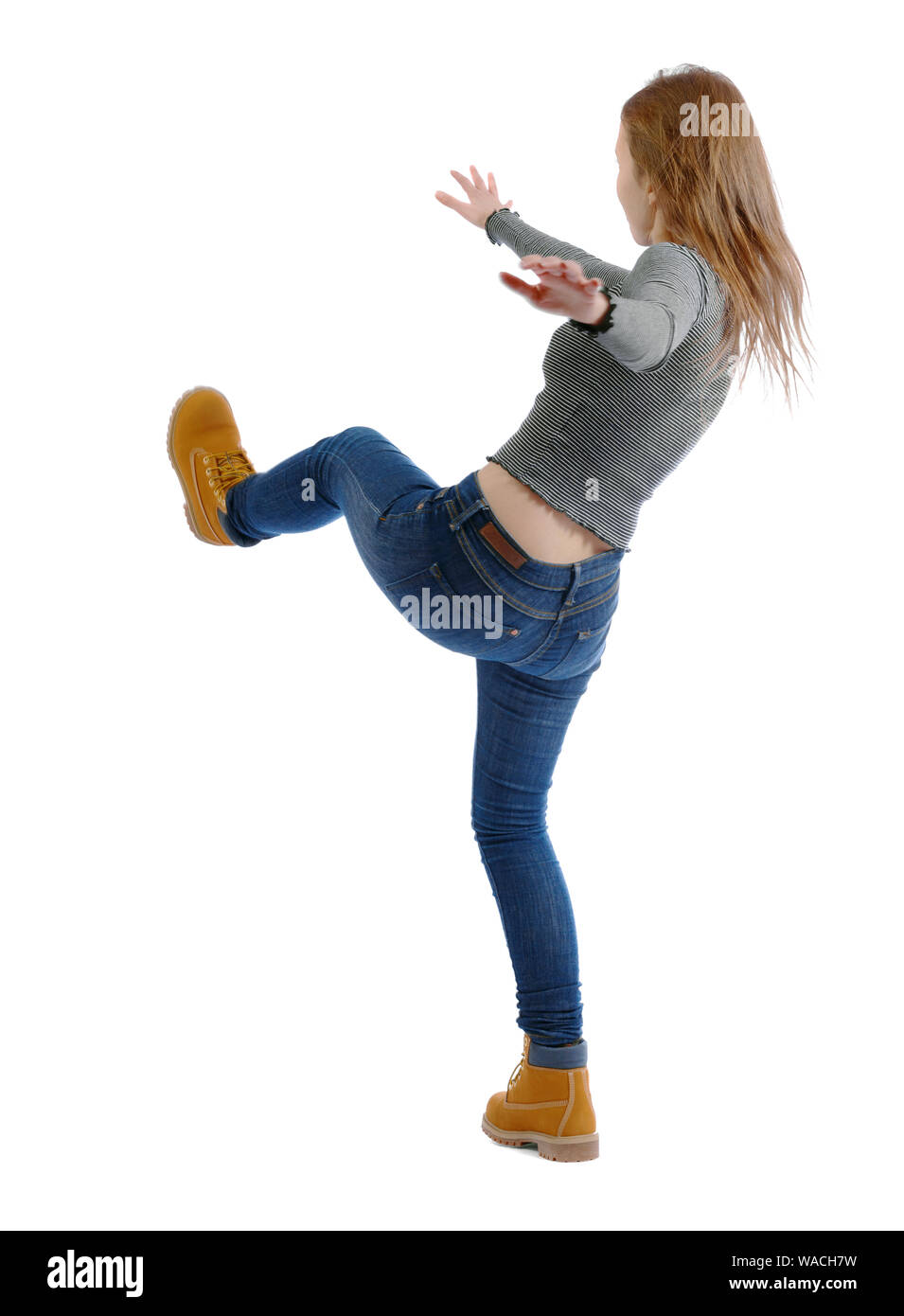 Balancing young woman. or dodge falling woman. Rear view people ...