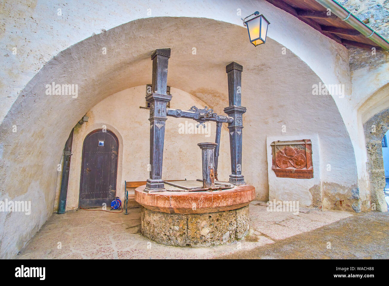 The medieval Keutschach cistern with stone well and wooden crane ...