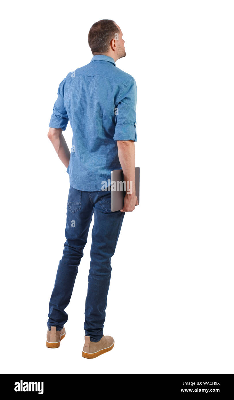Back view of a man who is standing with a laptop. Rear view people ...